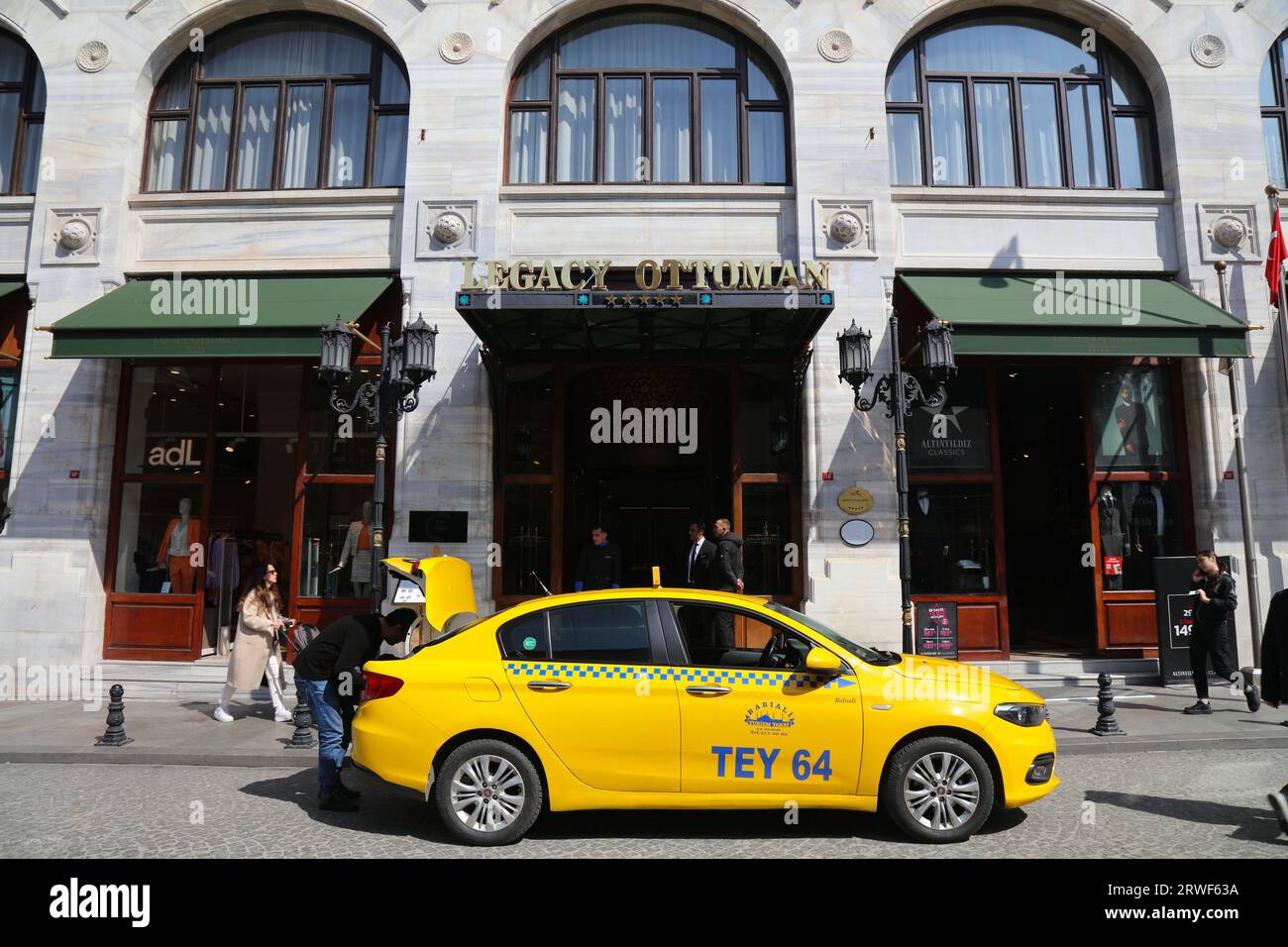 ISTANBUL, TURKEY - MARCH 25, 2023: Yellow taxi cab in front of Legacy ...