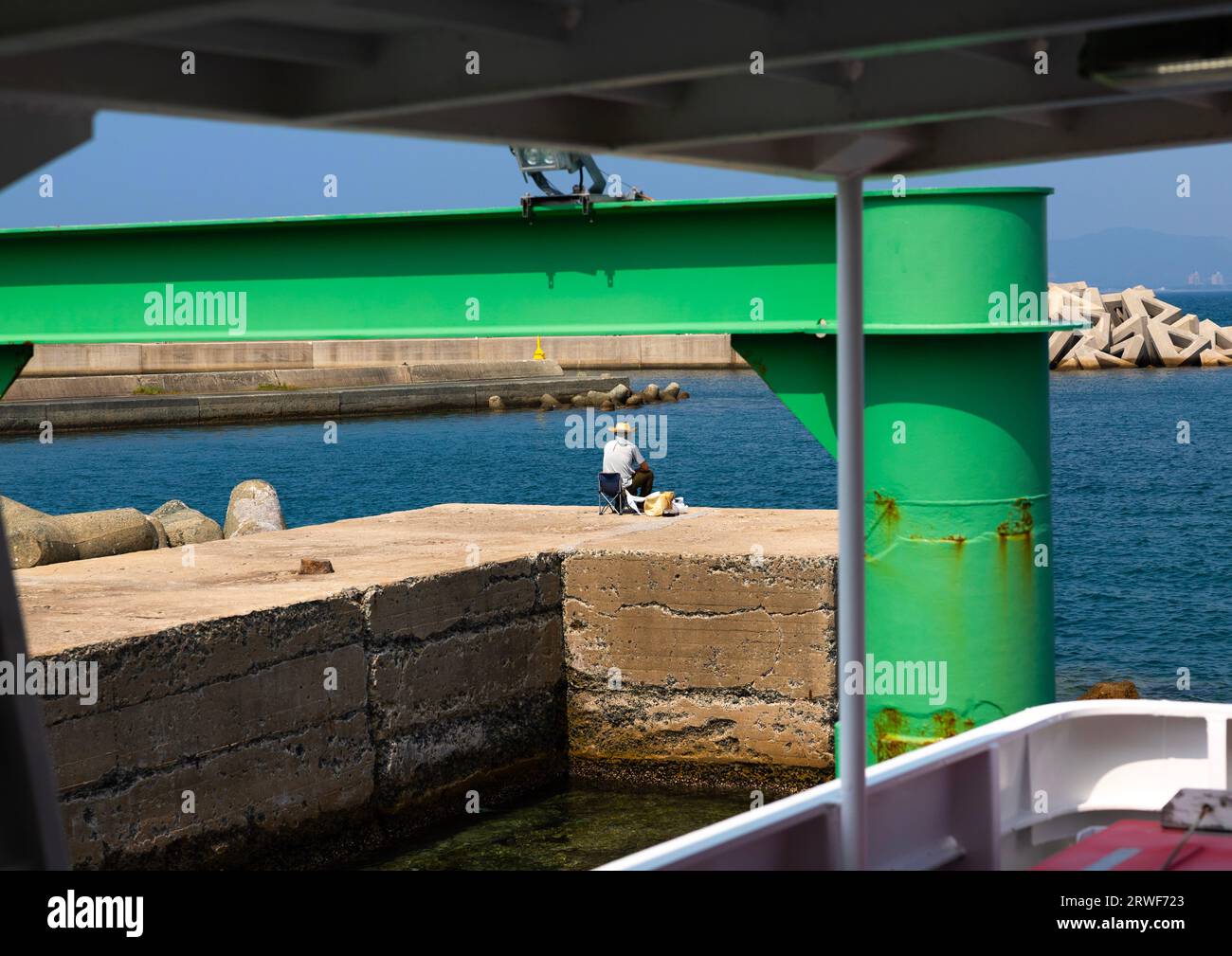 Fisherman in the port, Ainoshima Island, Shingu, Japan Stock Photo - Alamy