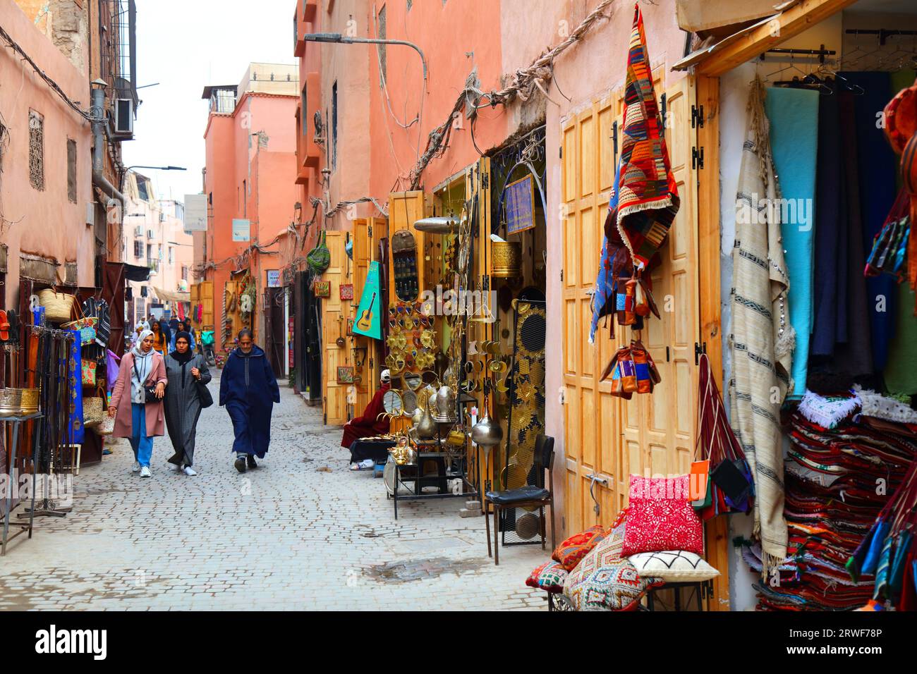 MARRAKESH, MOROCCO - FEBRUARY 20, 2022: People visit souk in medina ...