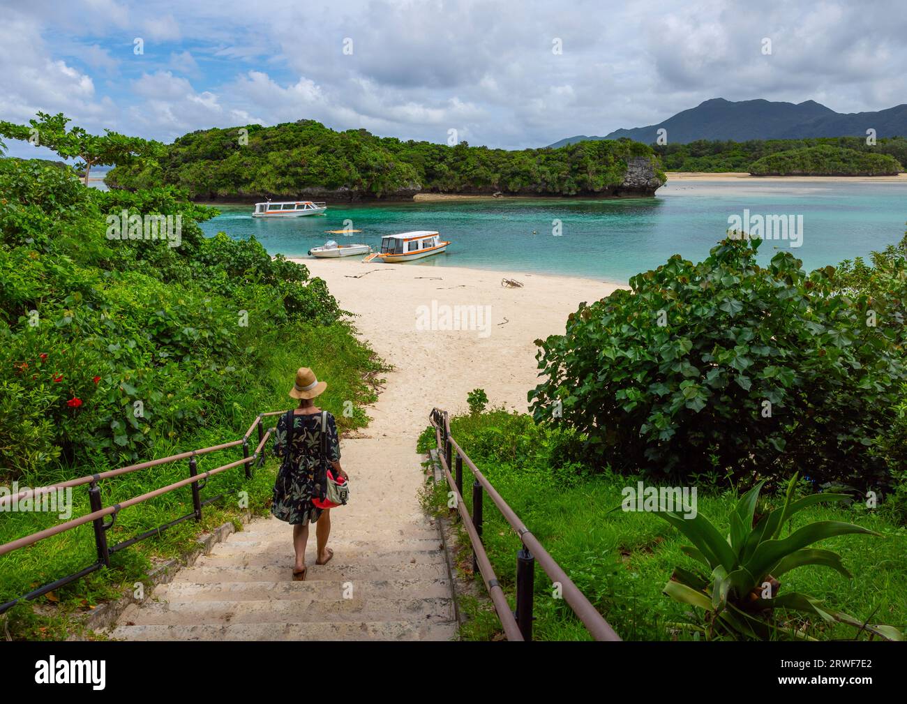 Tourists in tropical lagoon with clear blue water in Kabira bay ...