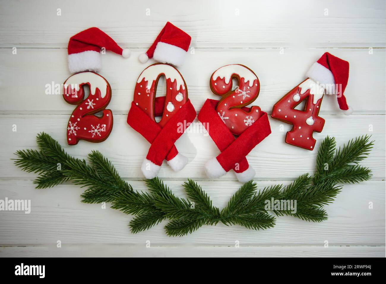 Figures from gingerbread 2024 in Christmas caps and scarve Stock Photo ...