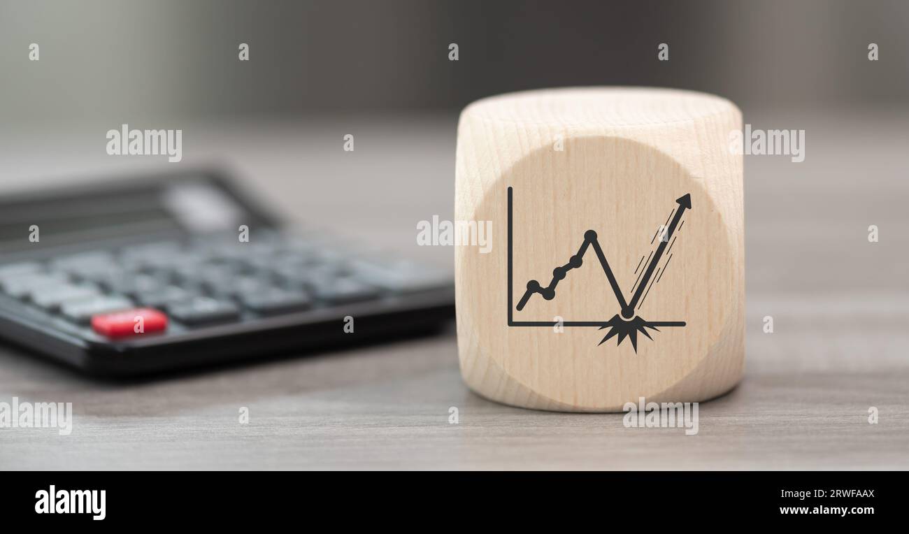 Wooden block with symbol of rebound concept and calculator on ...