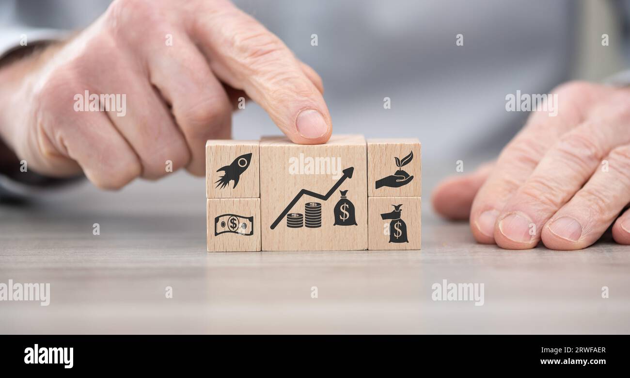 Wooden blocks with symbol of profit concept Stock Photo - Alamy