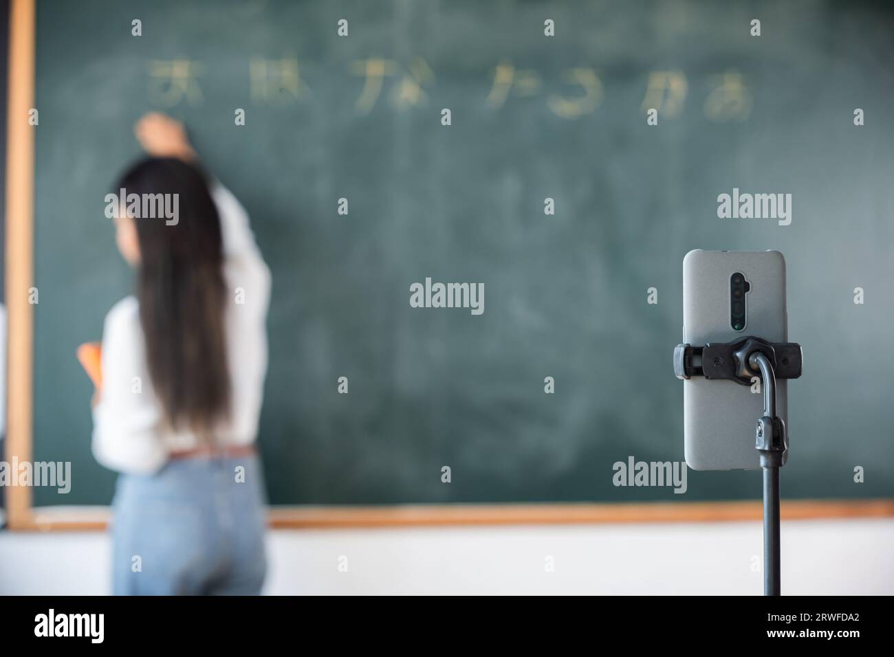 Asian teacher teach on board while have blackboard lecture online ...