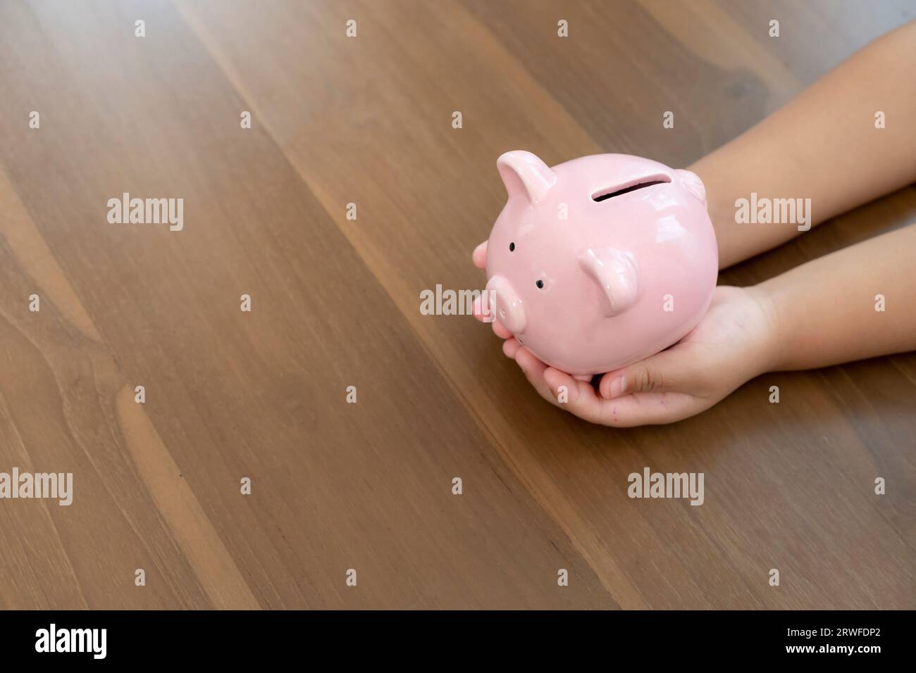 Young girl saving money at home Stock Photo - Alamy