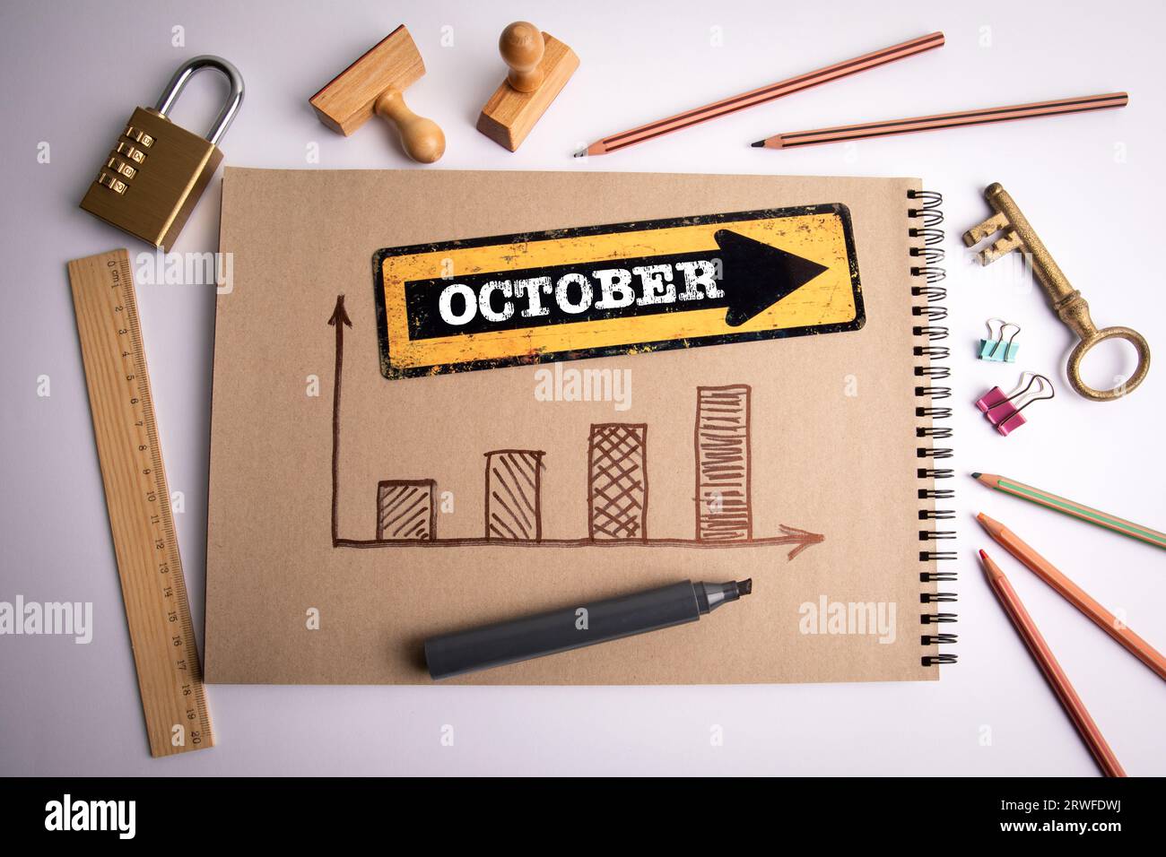 October Concept. Development chart in notepad. White office desk Stock ...