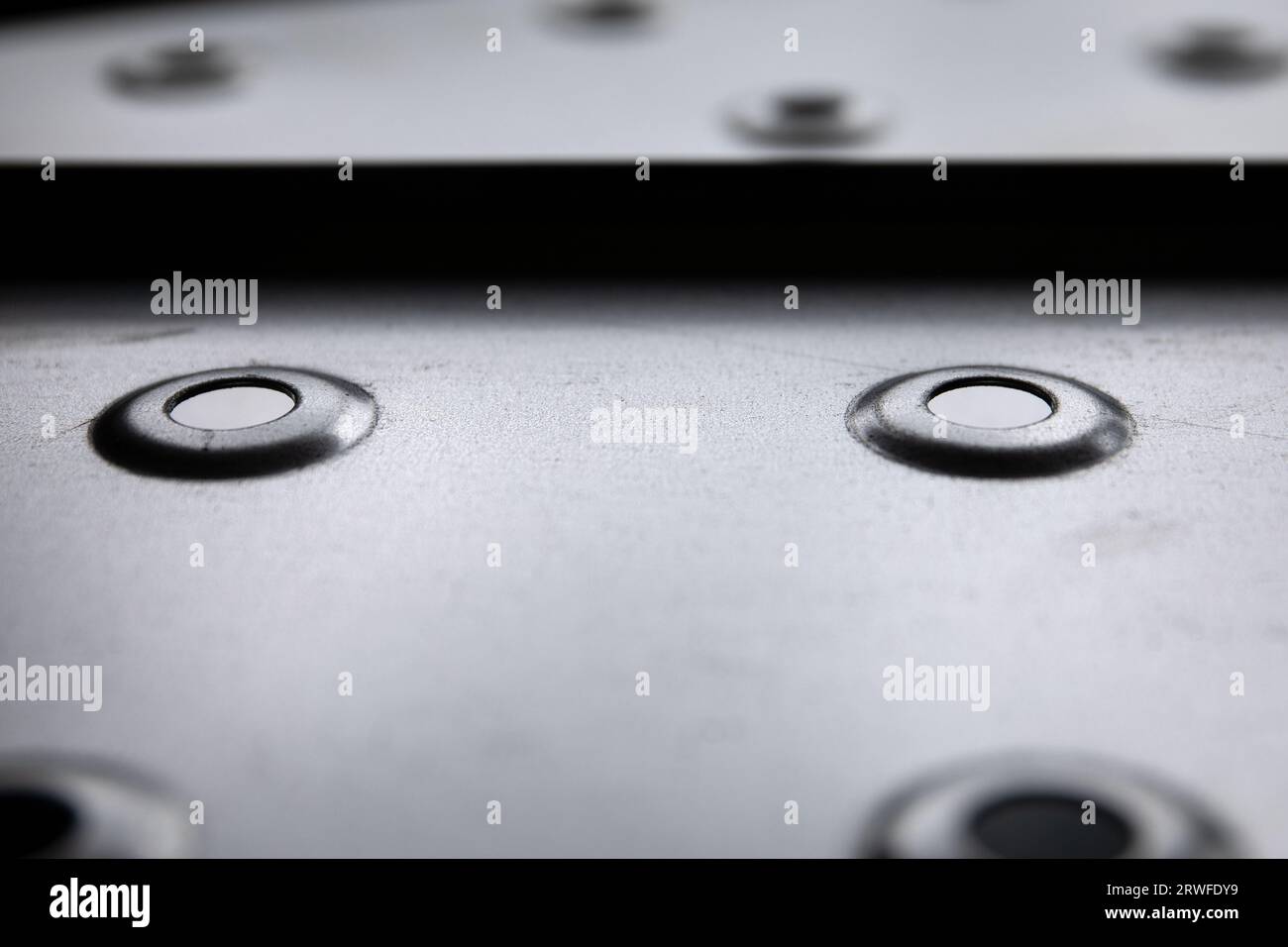 Industrial constructions. Galvanized metal plate surface with holes ...