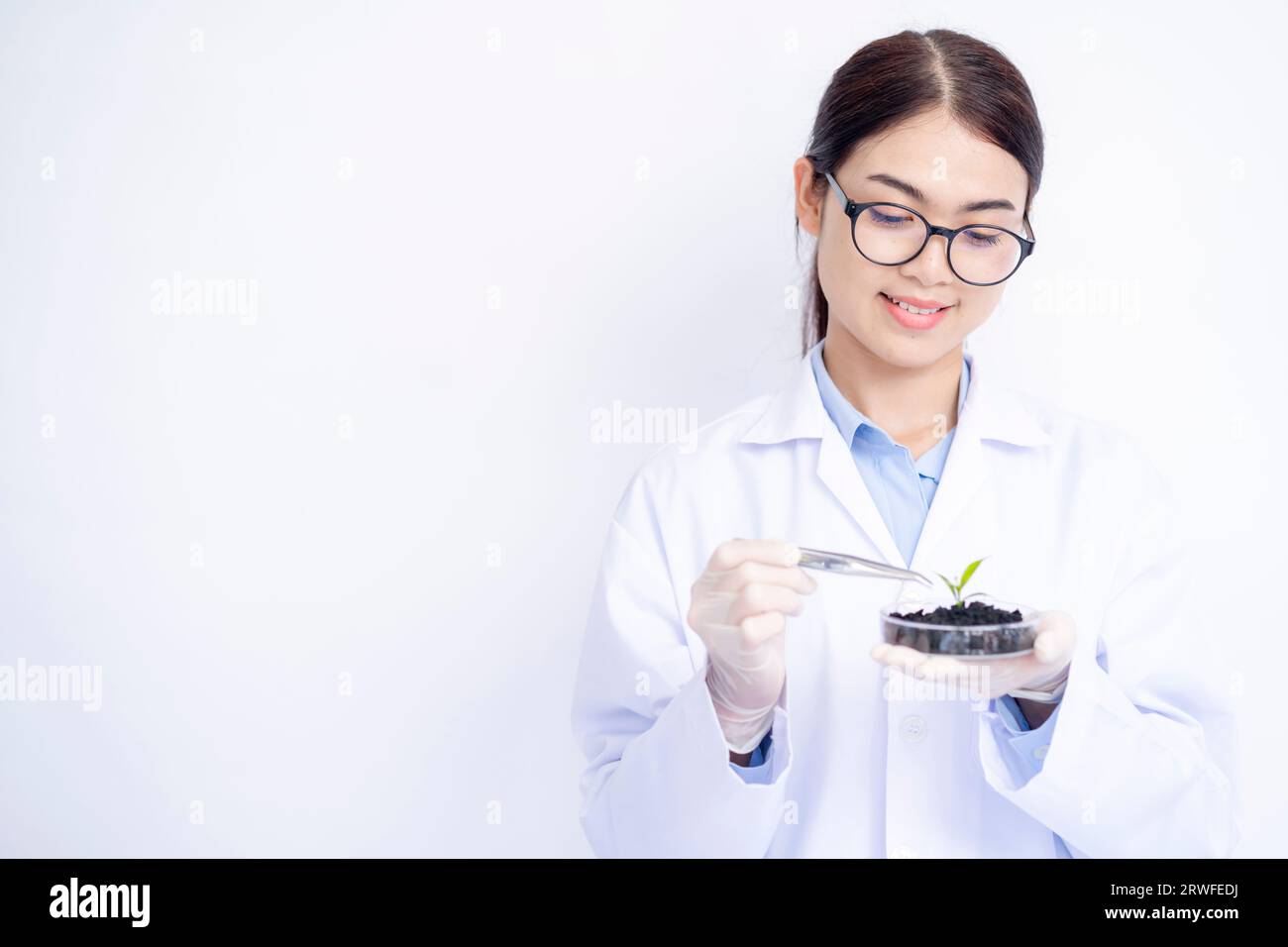 Scientist looking through microscope hi-res stock photography and ...