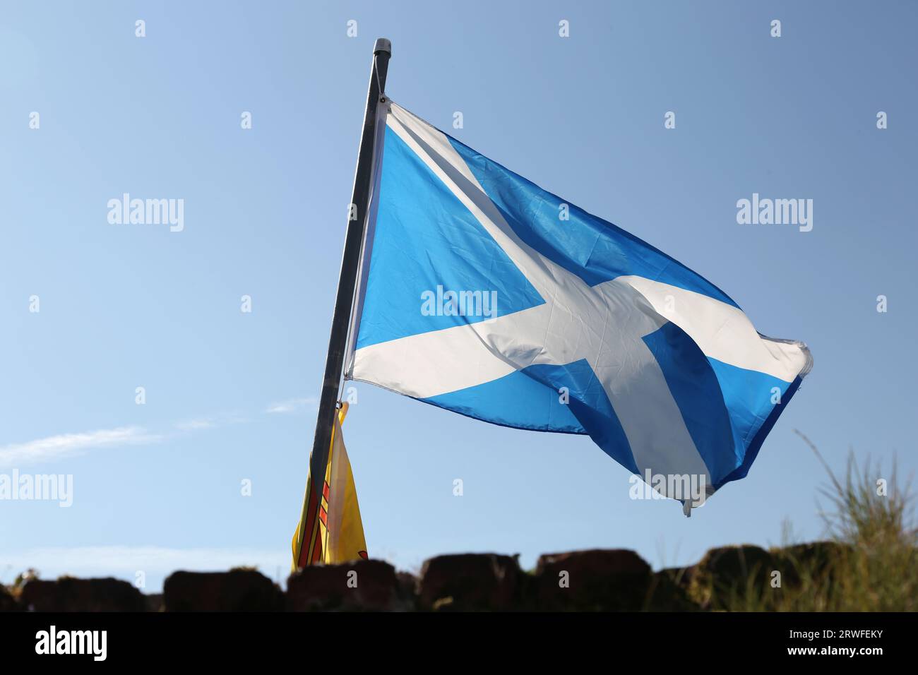 Scottish flag flying on the Stonehaven skyline Stock Photo - Alamy