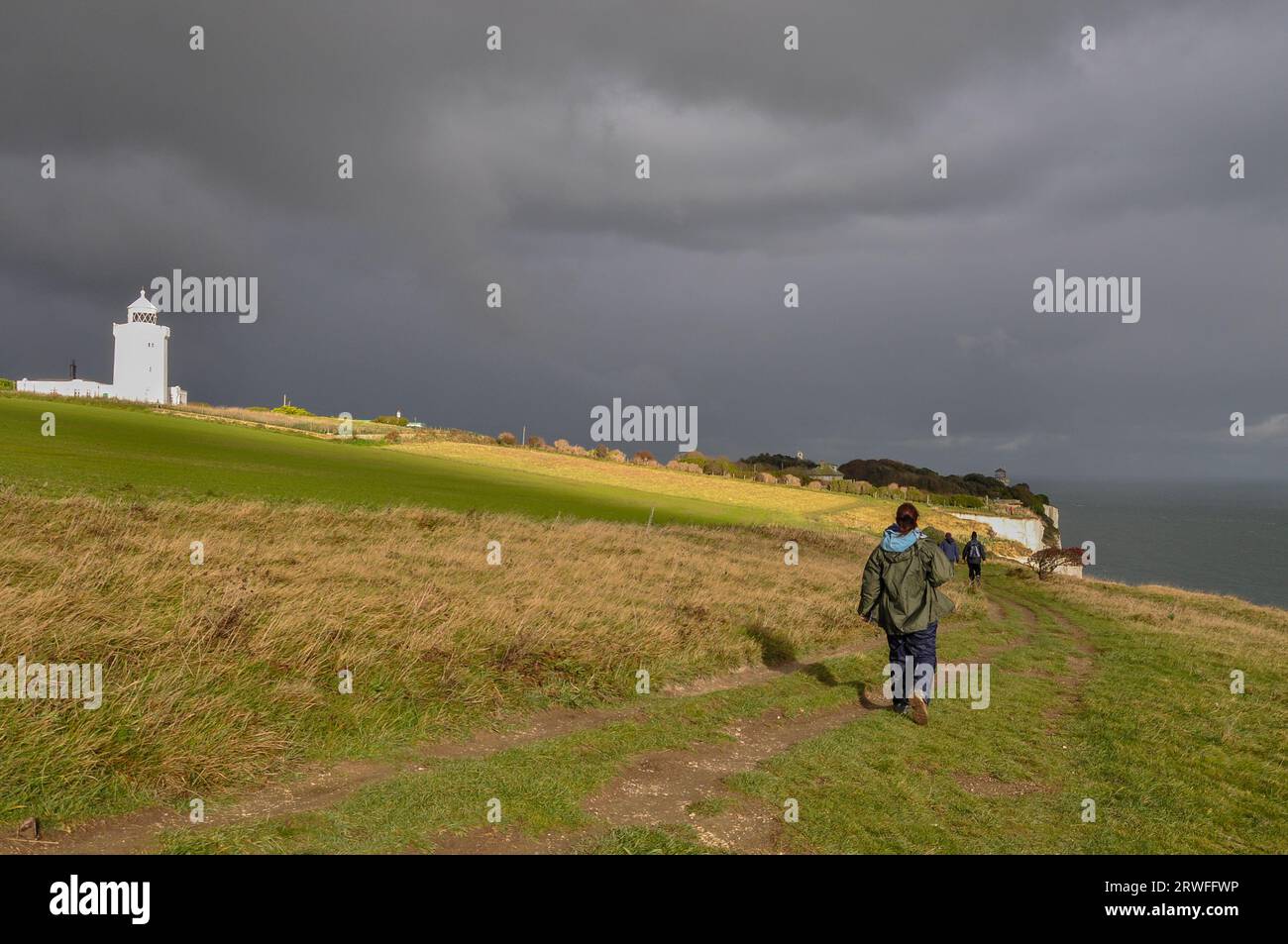 South Foreland Lighthouse, on cliffs at Dover in black storm clouds ...
