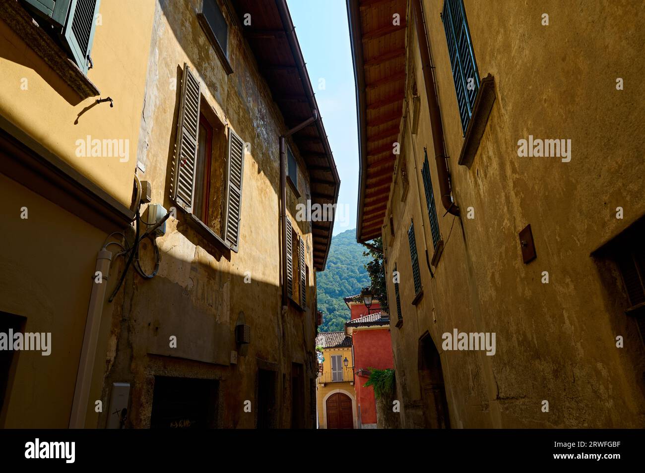 Italy, Lombardia, Canzo, narrow alley at historic old town. Street ...