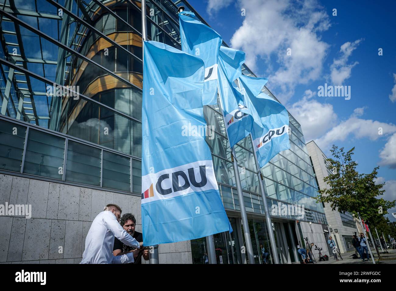 19 September 2023, Berlin: The new CDU logo can be seen on flags in ...