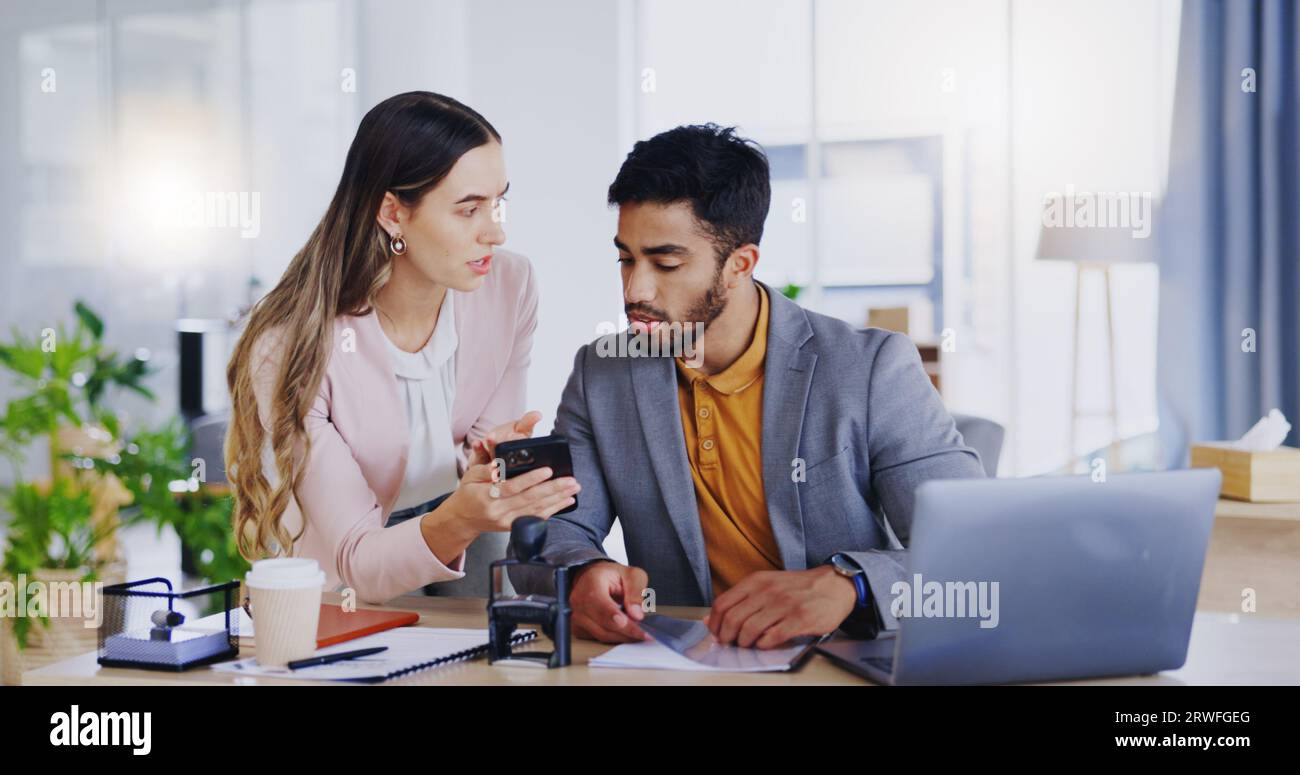 Laptop, phone and review with business people in the office, working ...