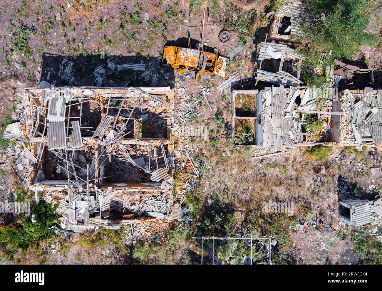 Aerial view of a destroyed village in the countryside after a battle ...
