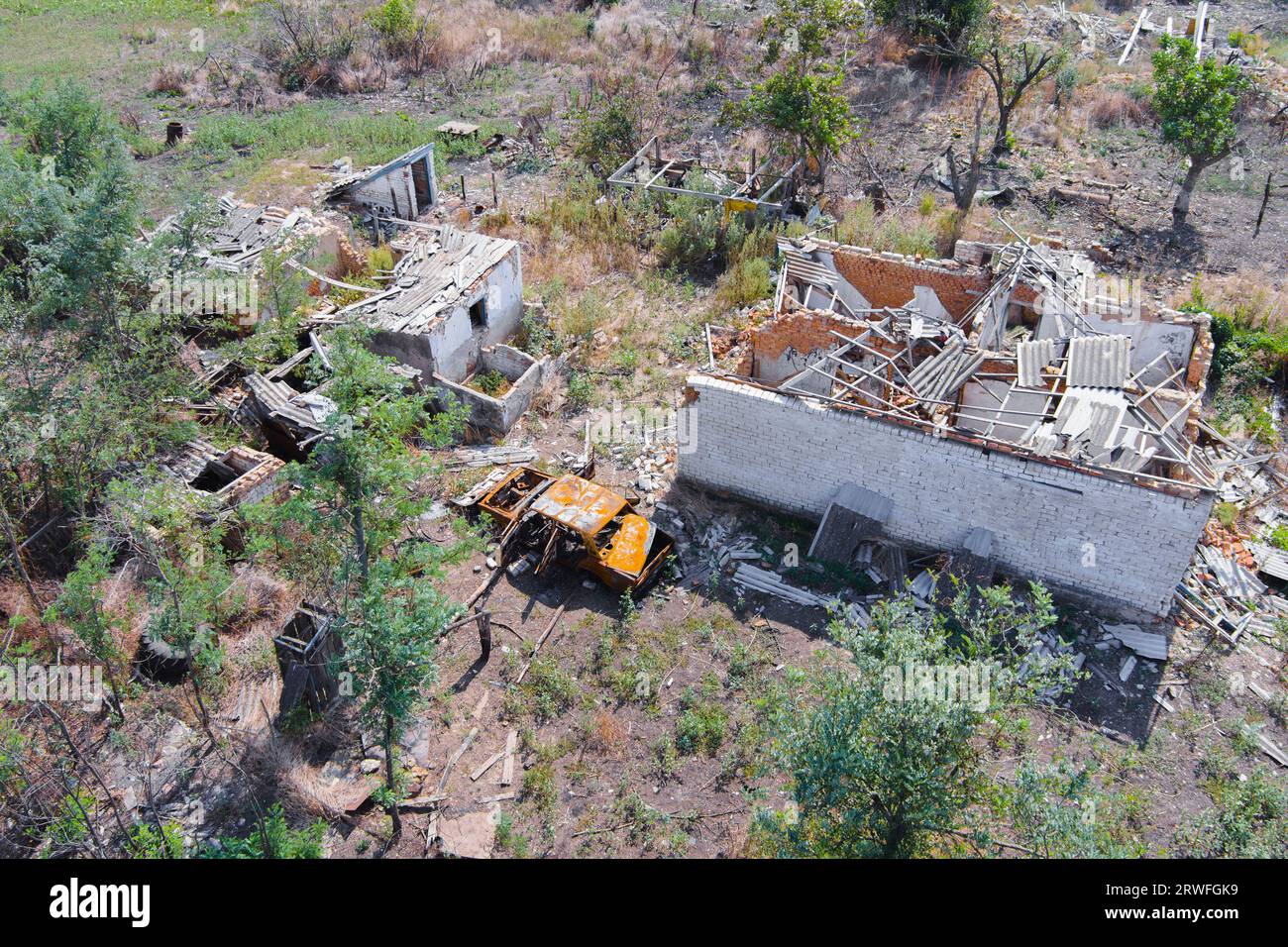 Aerial view of a destroyed village in the countryside after a battle ...