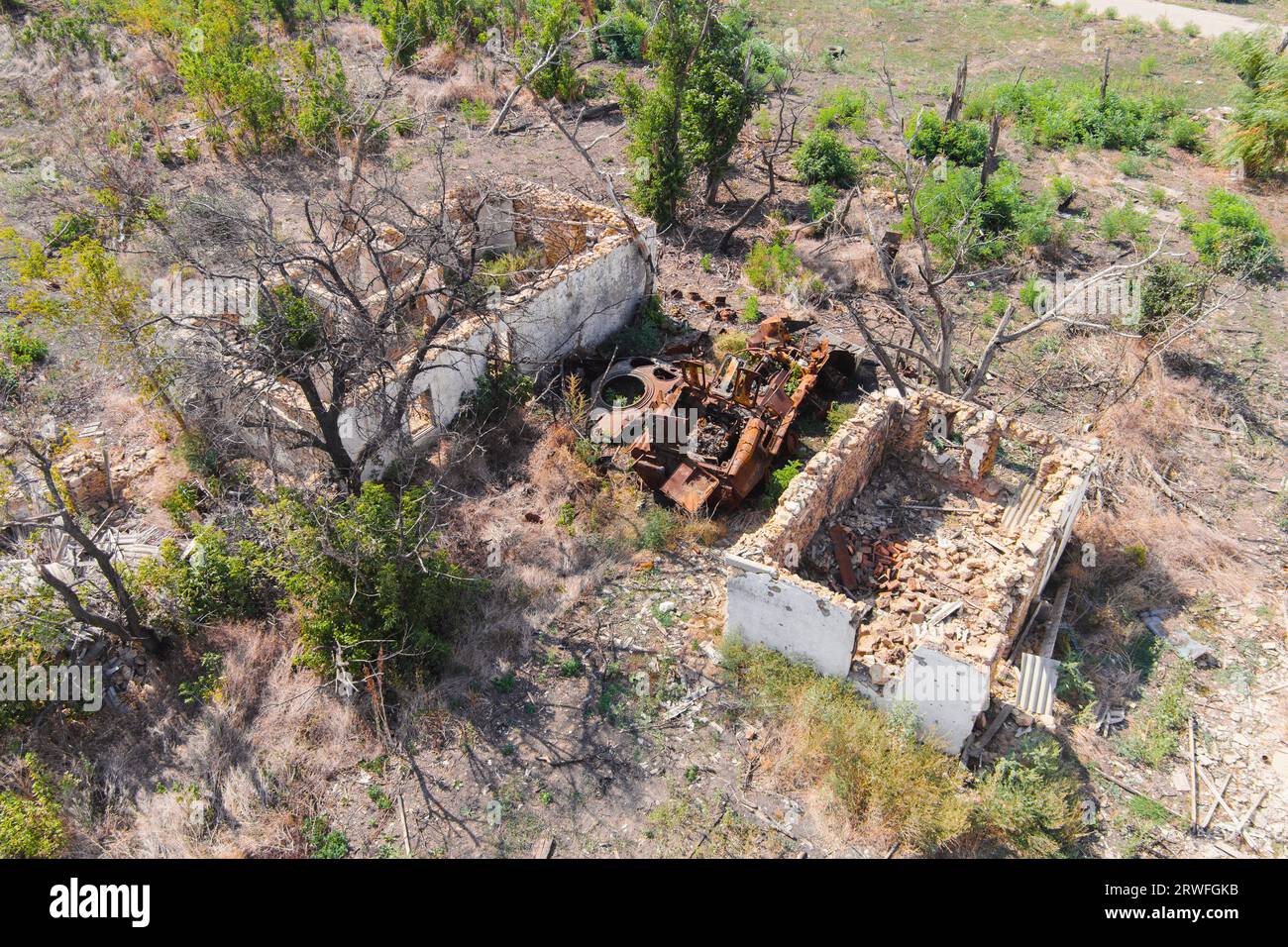 Aerial view of a destroyed village in the countryside after a battle ...