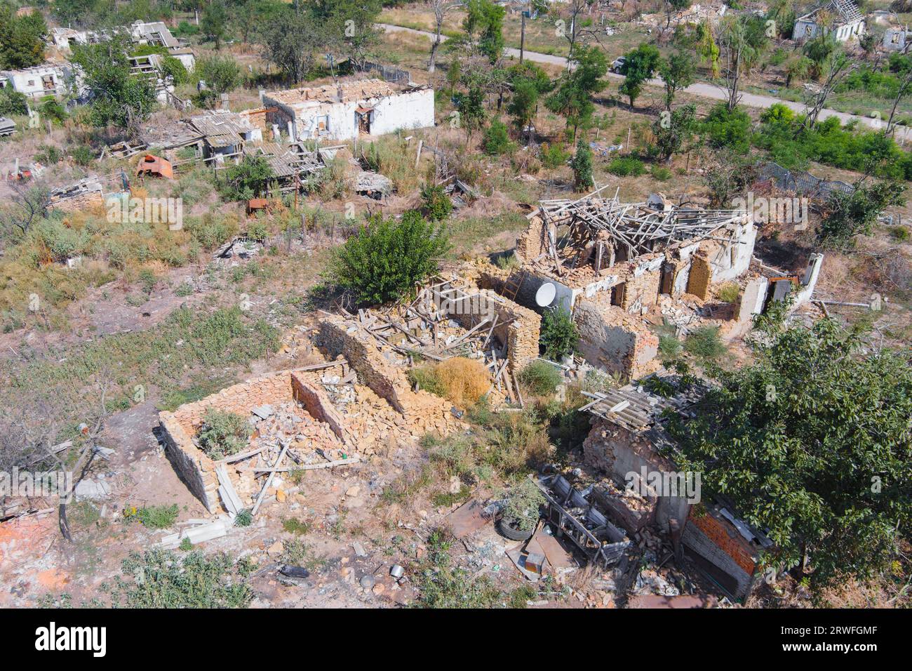 Aerial view of a destroyed village in the countryside after a battle ...