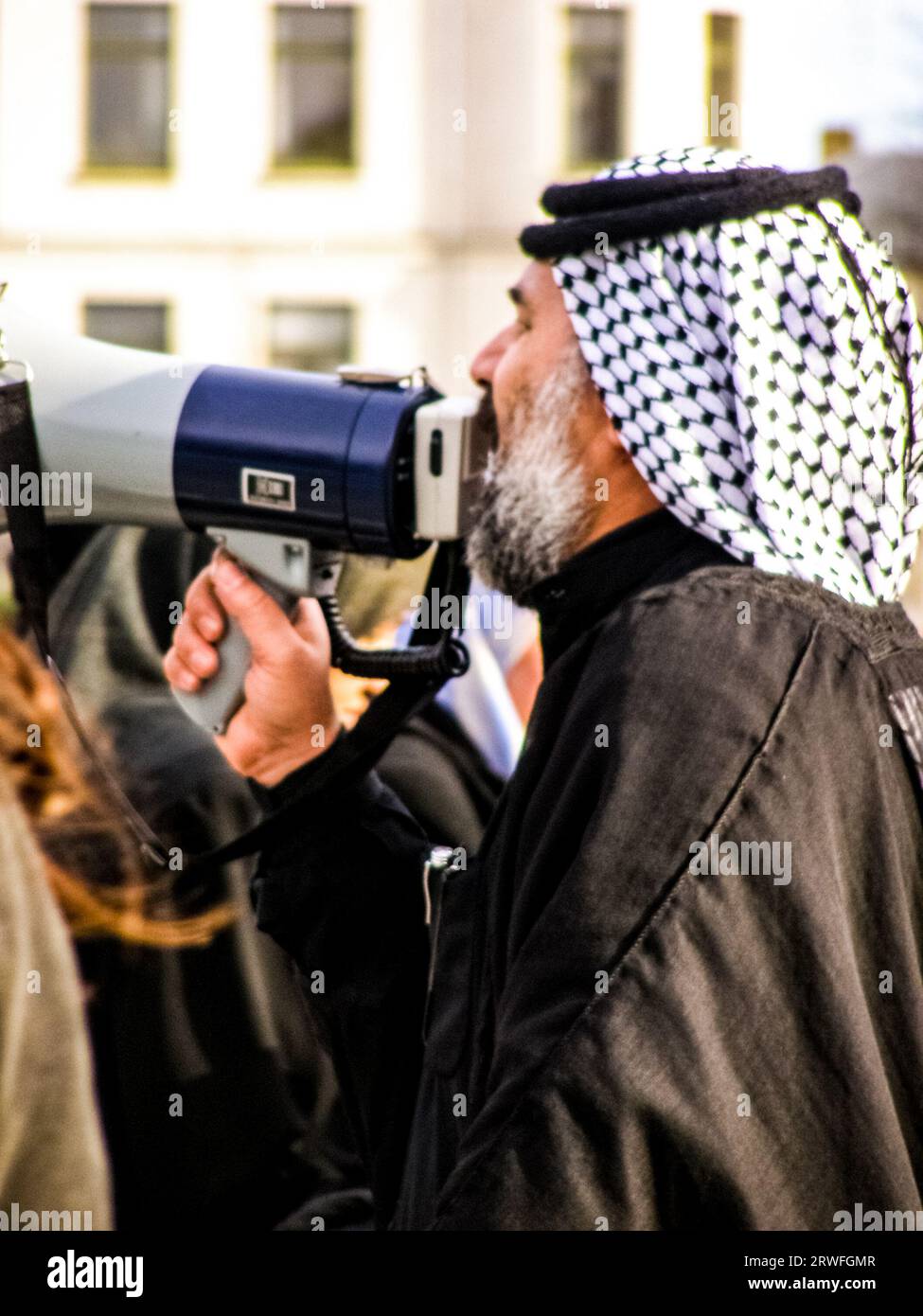 MALMO, SWEDEN - 10 MARCH, 2007: An arabic man shouting in a megaphone ...