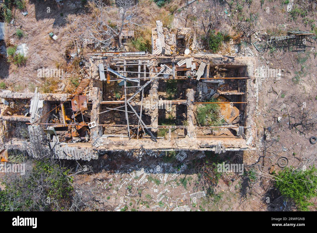 Aerial view of a destroyed village in the countryside after a battle ...