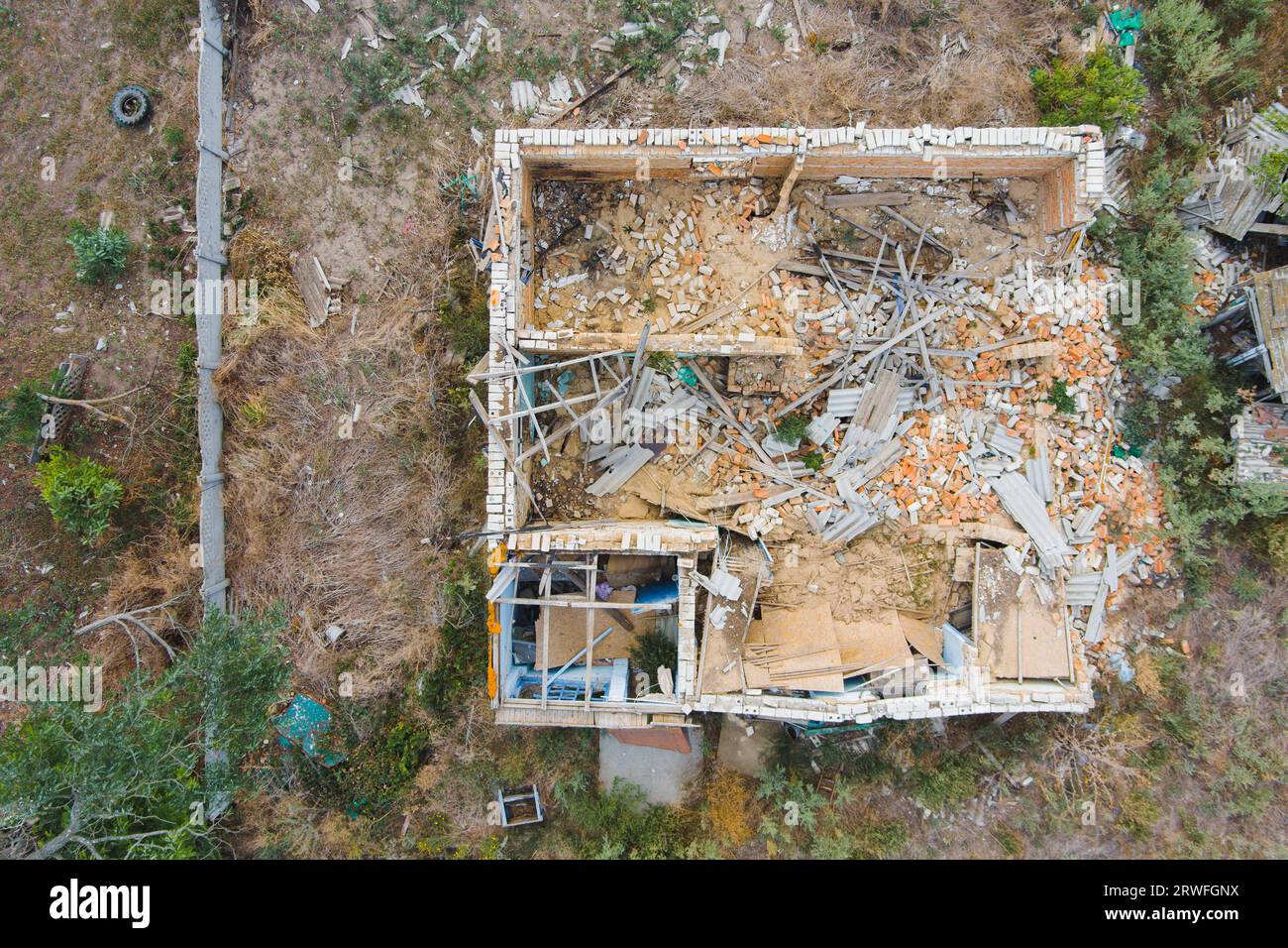 Aerial view of a destroyed village in the countryside after a battle ...