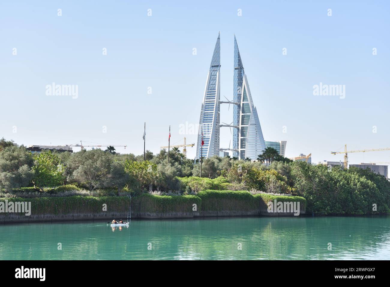 Bahrain World Trade Center Twin Towers with Wind Turbines and Kayak in ...