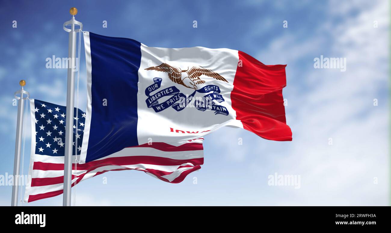 Iowa state flag waving in the wind with the American national flag on a ...