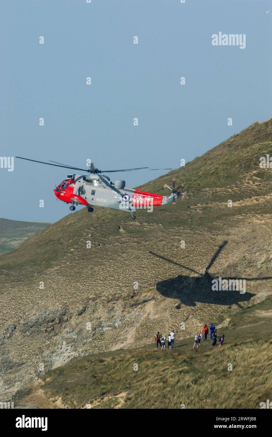 Rescue of two men cut off by incoming tide near Perranporth & forced to ...