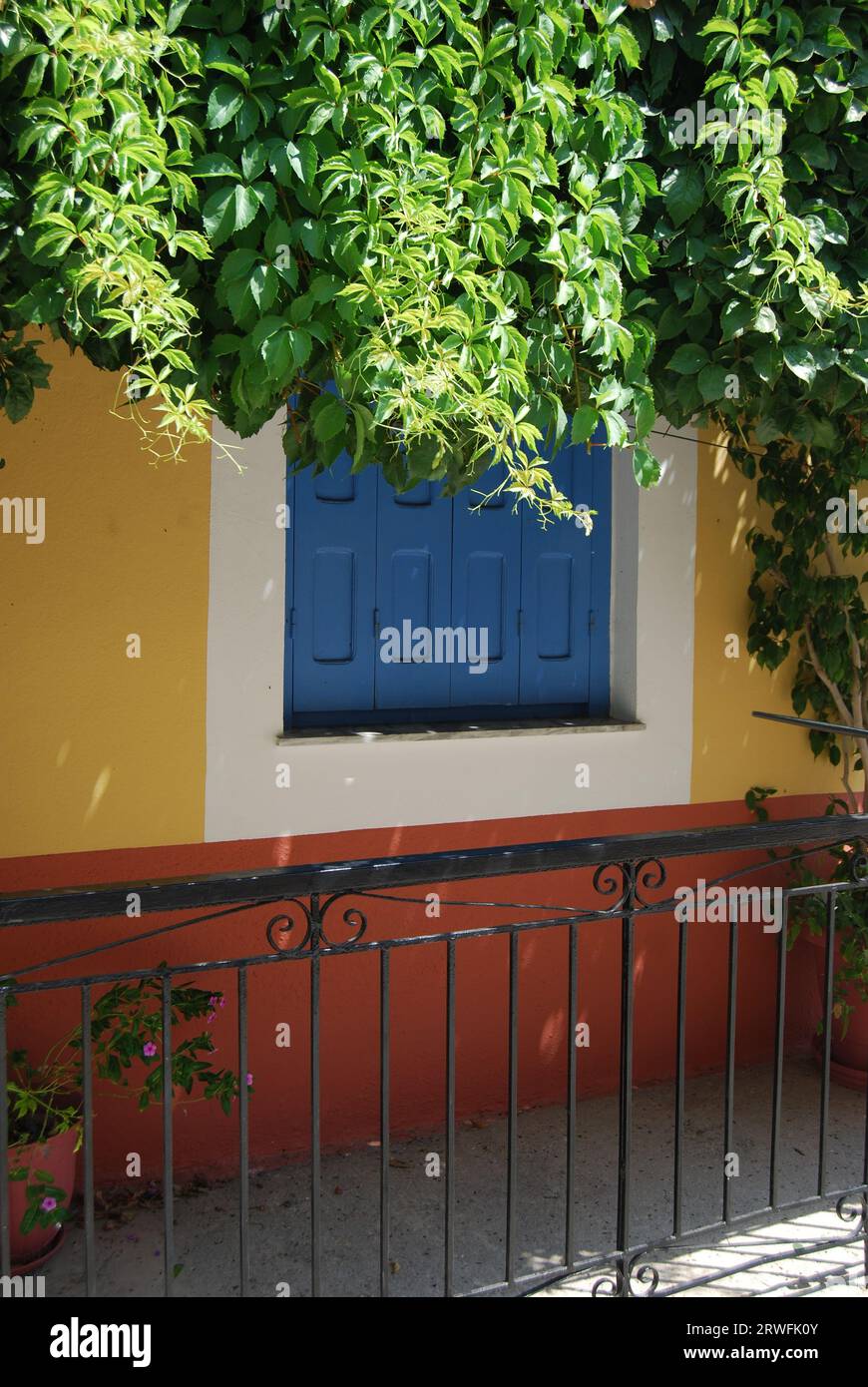 Detail view of traditional colorful Greek window, Symi Island ...