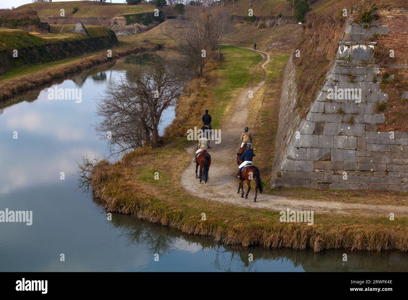 Horseback riders gracefully explore Palmanova's bastions, blending ...