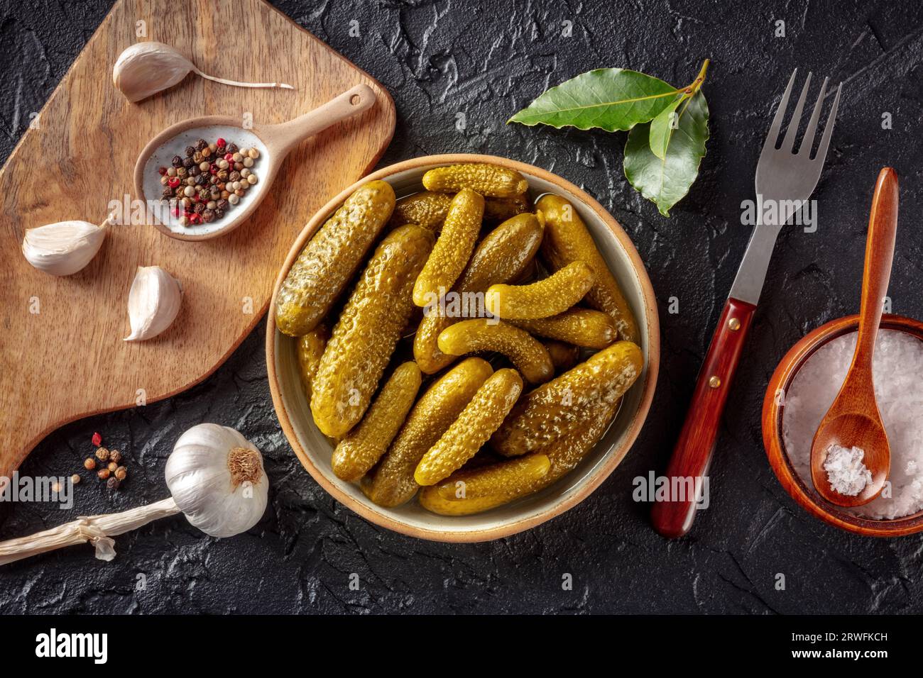 Pickled cucumbers with salt, pepper, garlic, and bay leaf. Fermented ...