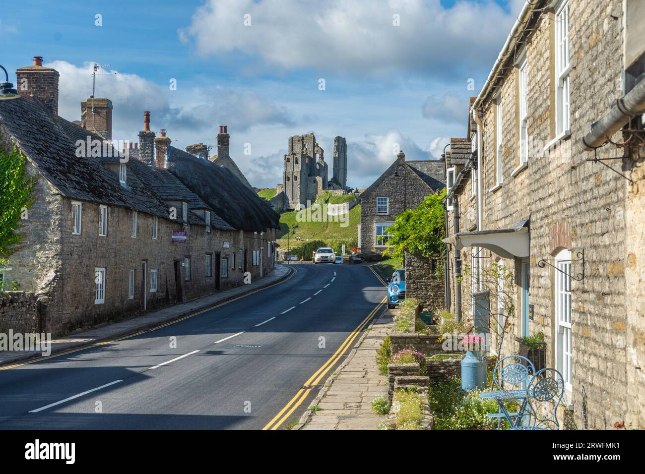 East Street, Corfe Castle, UK - September 14th 2023: Terraced stone ...