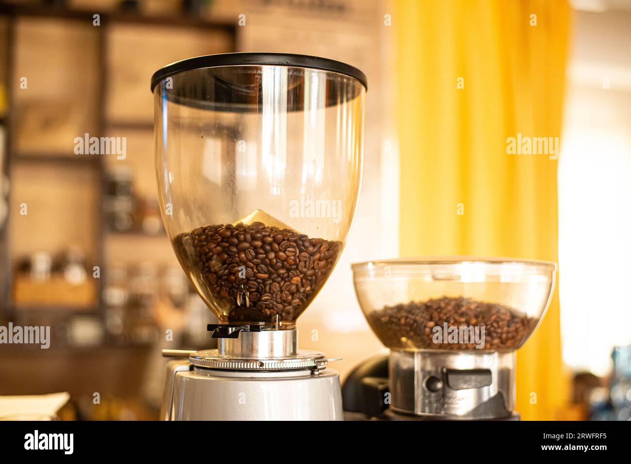 grinding coffee in coffee machine Stock Photo - Alamy