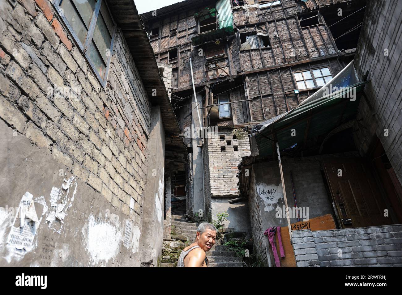04.08.2012, Chongqing, China, Asia - A man climbs old stone stairs in the Eighteen Stairs Area ...