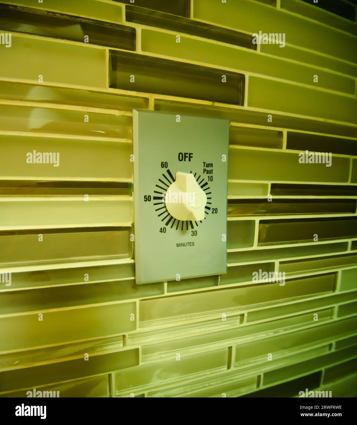 Iconic old-school wall-mounted kitchen appliance timer. Electrical ...