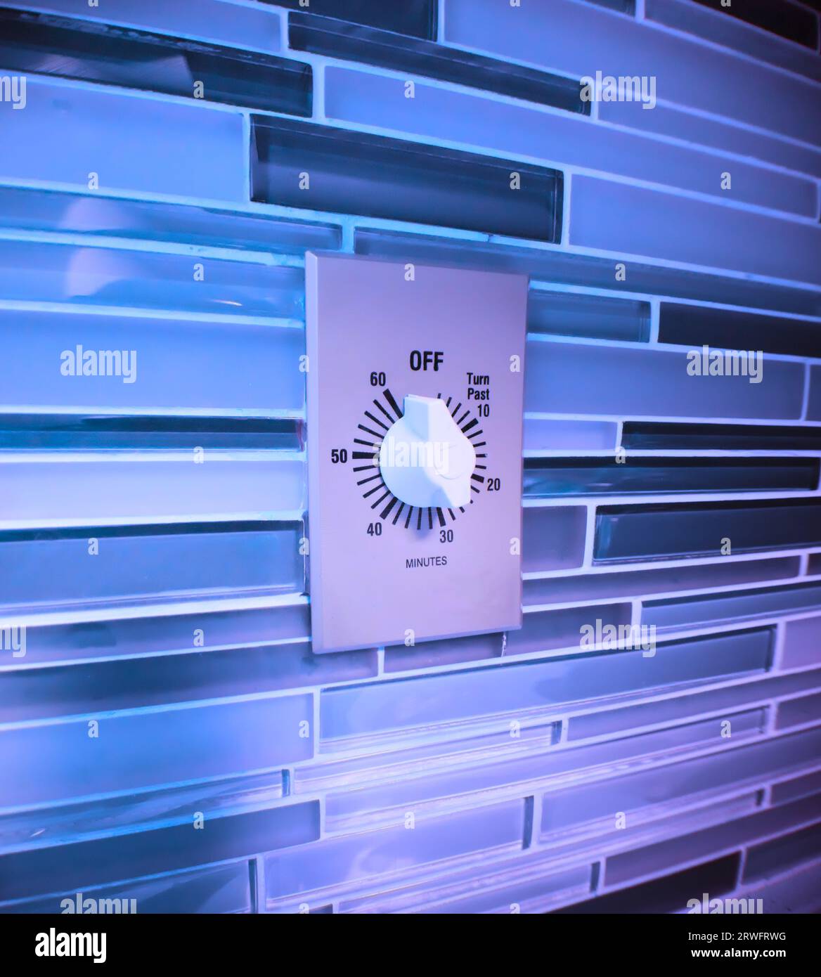 Iconic old-school wall-mounted kitchen appliance timer. Electrical ...