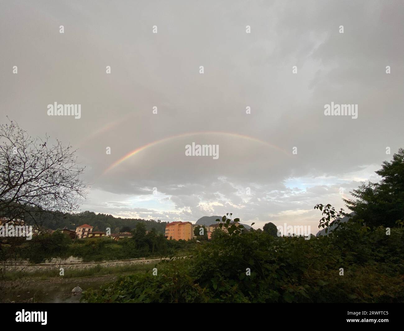Sunset with a double rainbow arch Stock Photo - Alamy
