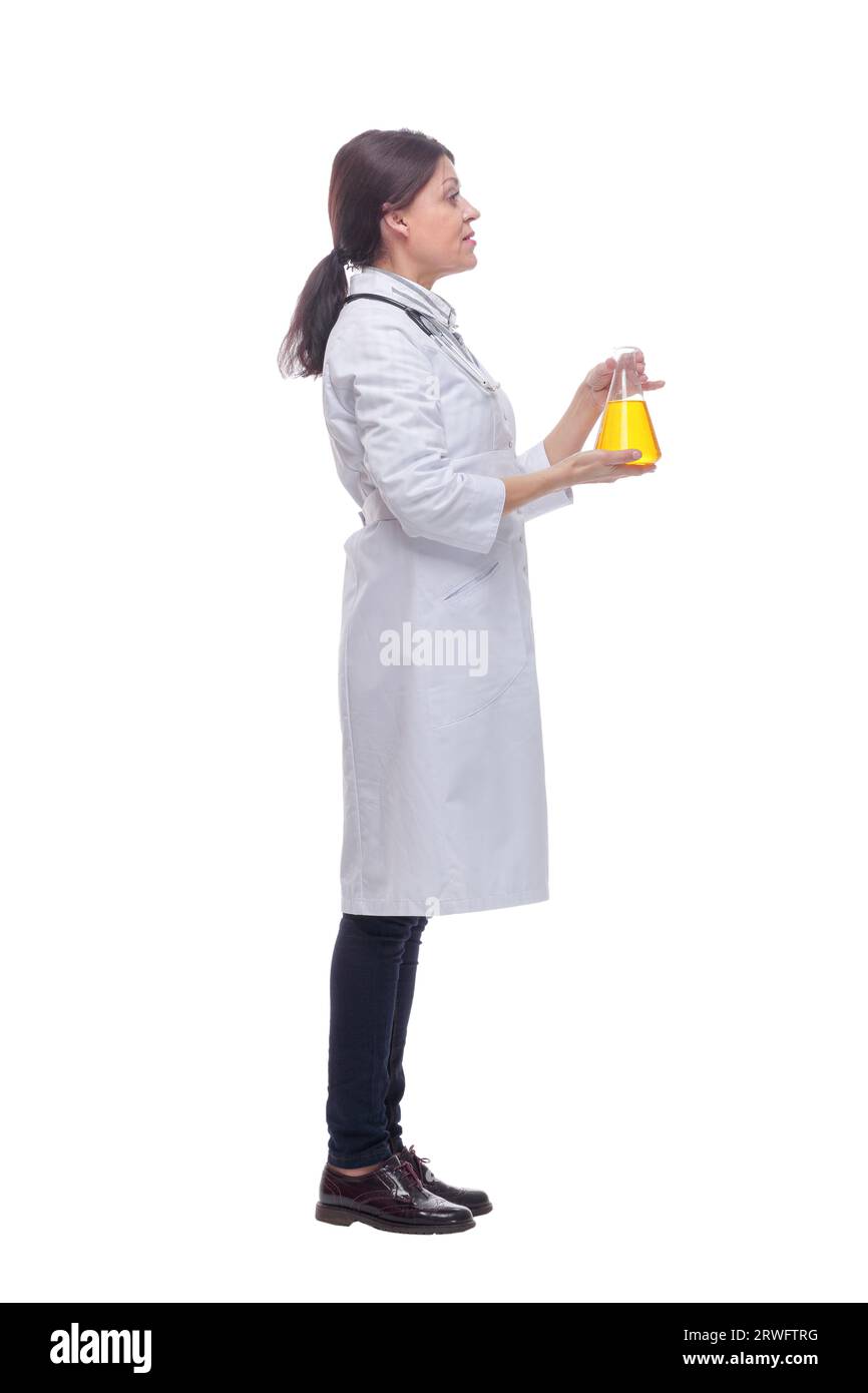 Scientist holding up beaker with of chemical yellow liquid Stock Photo ...