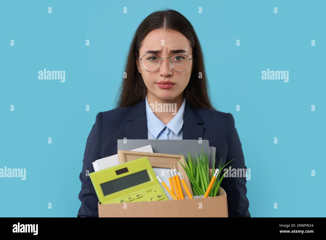Unemployment problem. Unhappy woman with box of personal office ...