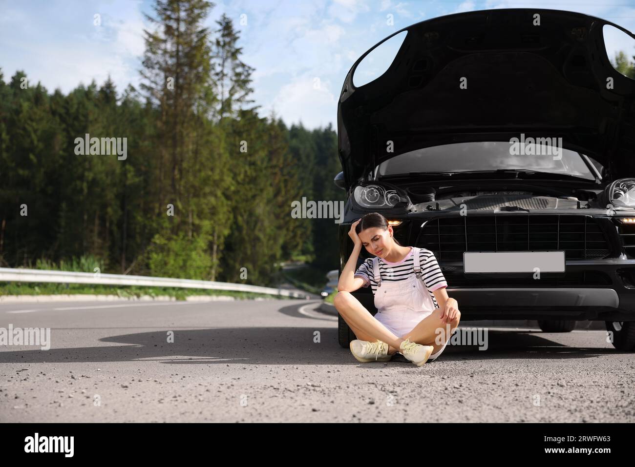Person portrait sitting on hood of car hi-res stock photography and images - Alamy