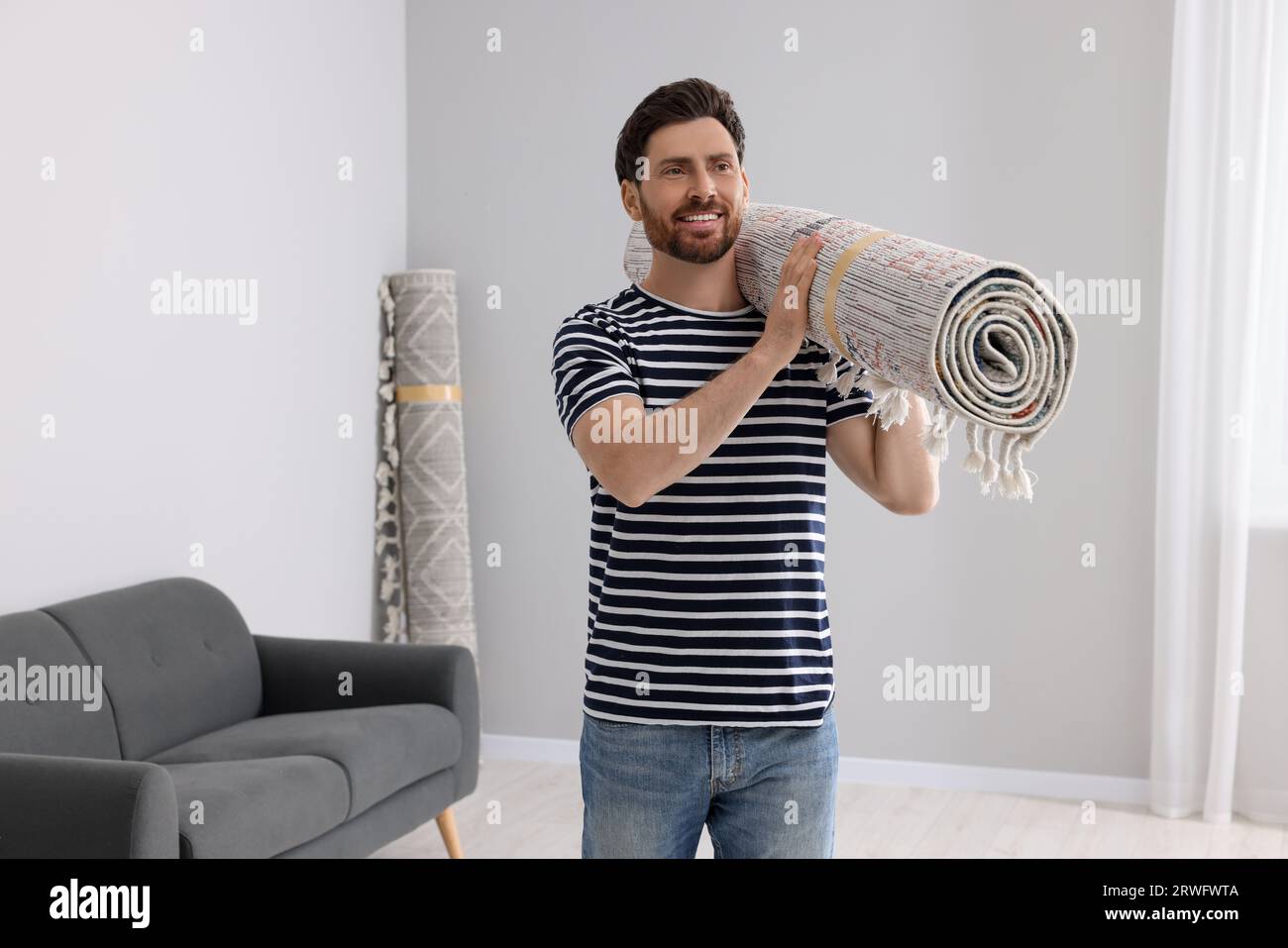 Person in rolled carpet hi-res stock photography and images - Alamy