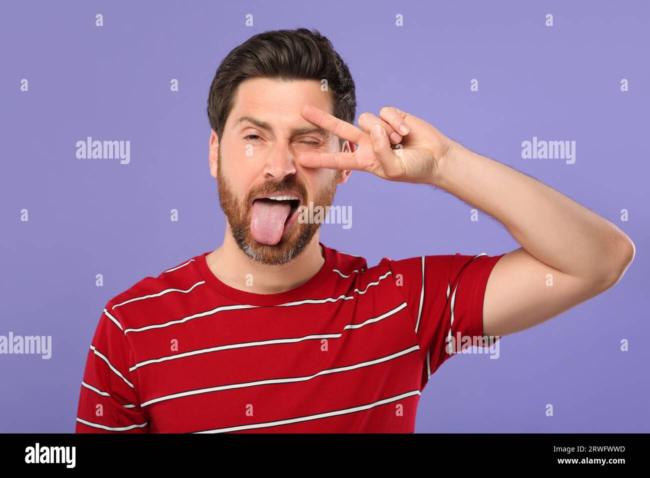 V sign tongue hi-res stock photography and images - Alamy
