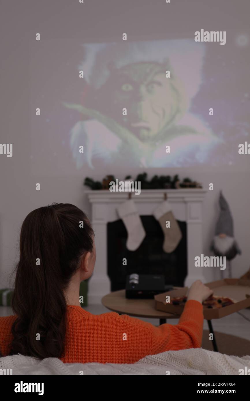 Lviv, Ukraine – January 24, 2023: Woman watching How the Grinch Stole ...