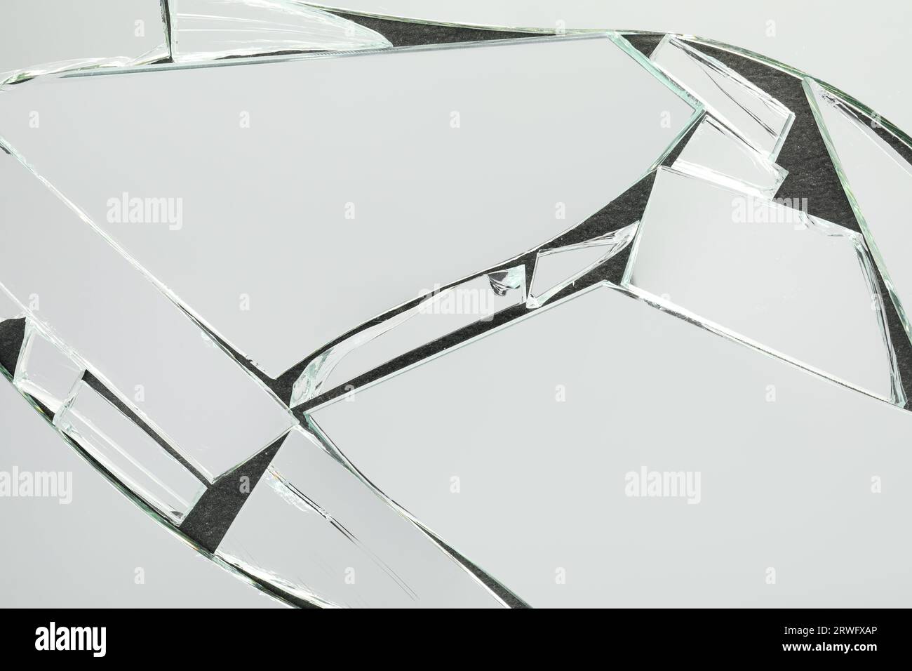 Shards of broken mirror on dark background, top view Stock Photo - Alamy