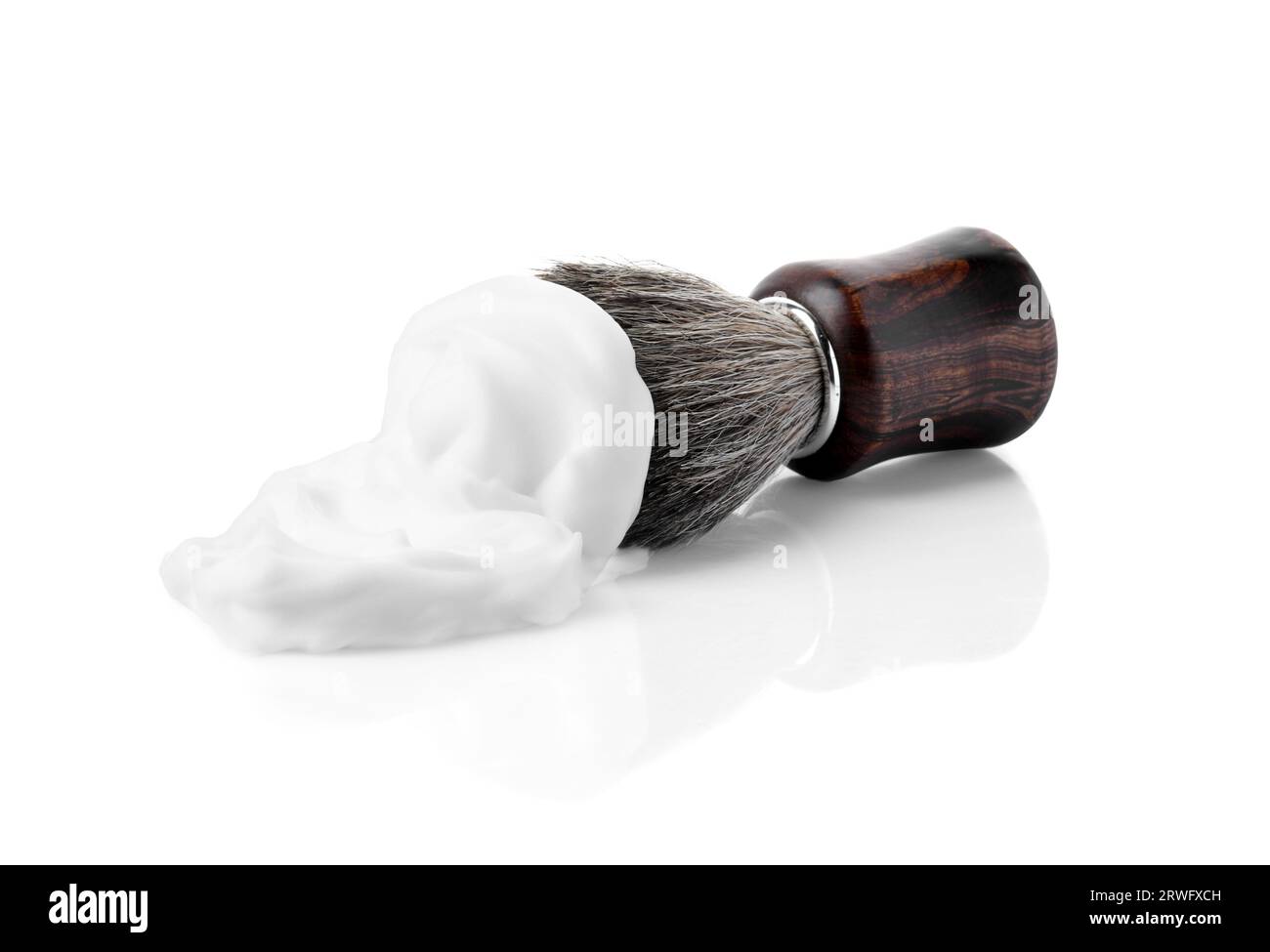 Shaving foam and brush on white background Stock Photo - Alamy