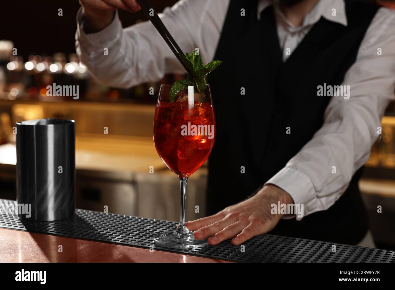 Bartender making fresh alcoholic cocktail at bar counter, closeup Stock ...