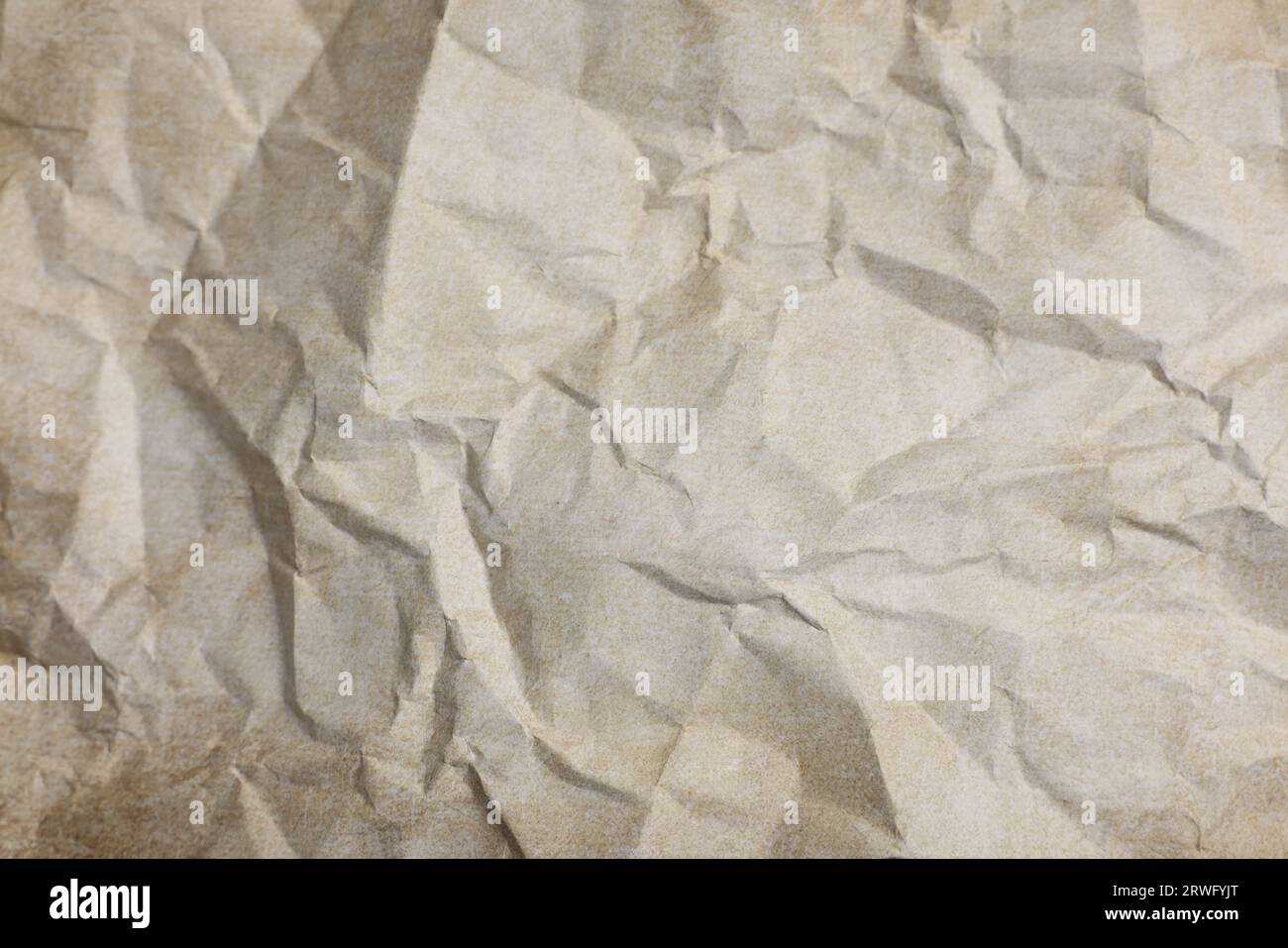 Texture of crumpled parchment paper as background, top view Stock Photo ...