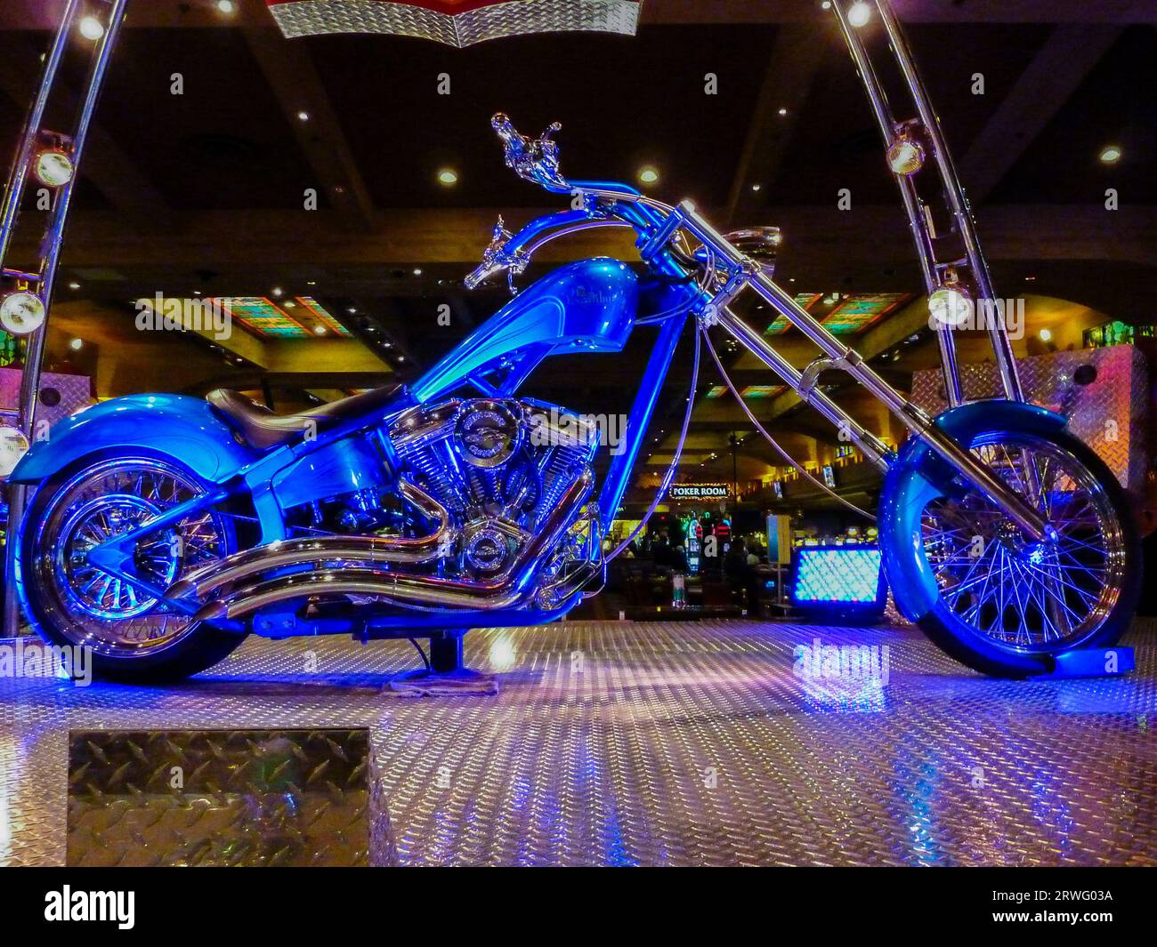 Illuminated blue custom motorcycle on display inside the casino of The ...
