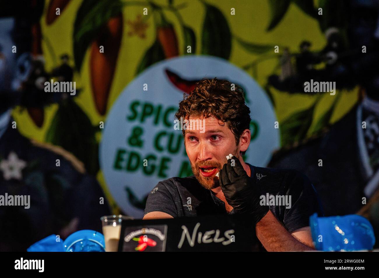 A participant seen crying after eating a very spicy pepper. The pepper ...