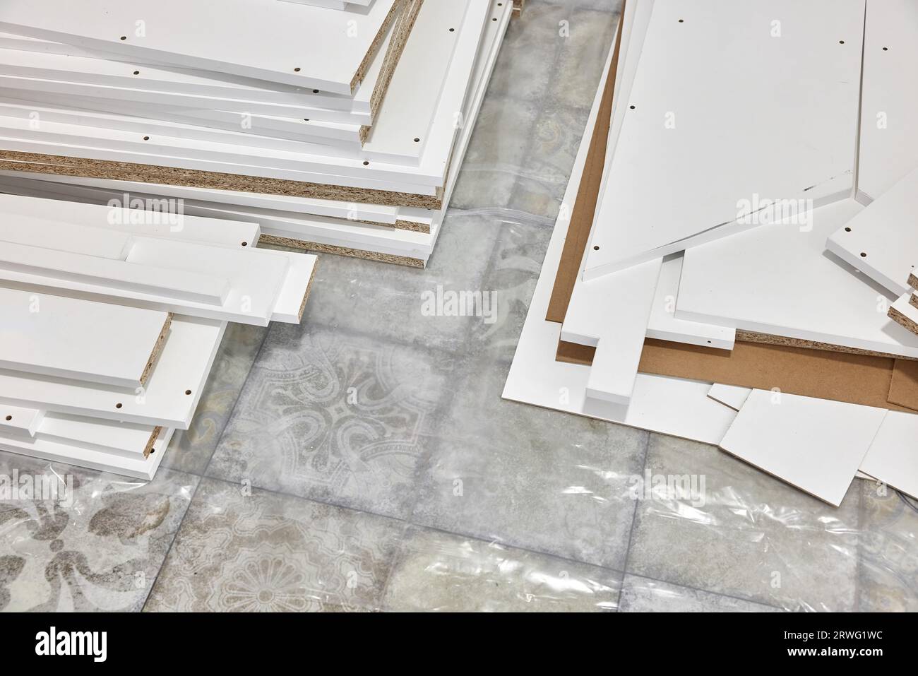 stack of white MDF panels lie on floor Stock Photo - Alamy