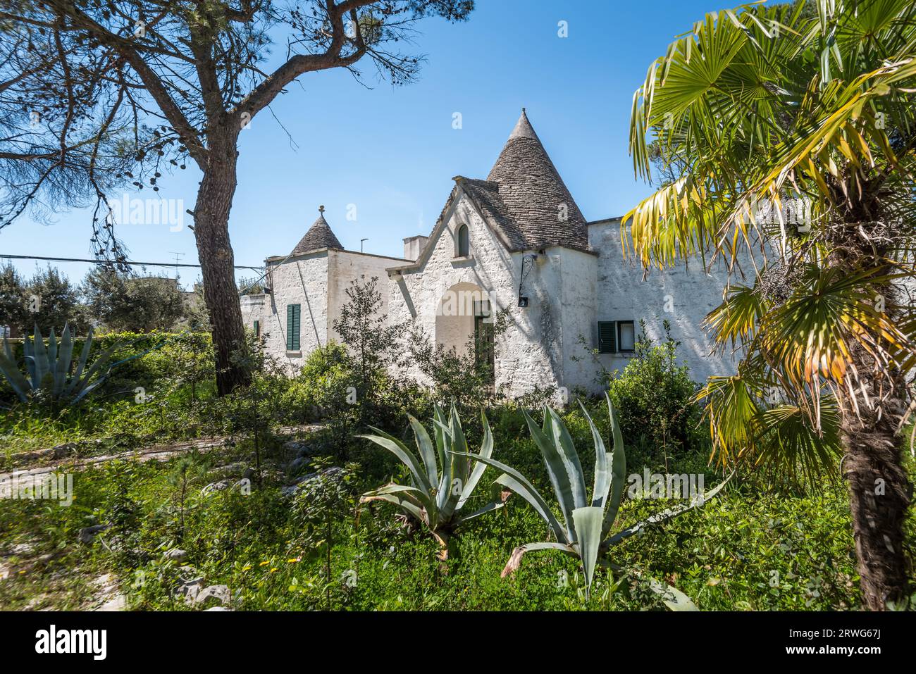 Scenic view of trulli whitewashed huts with stone conical roofs ...
